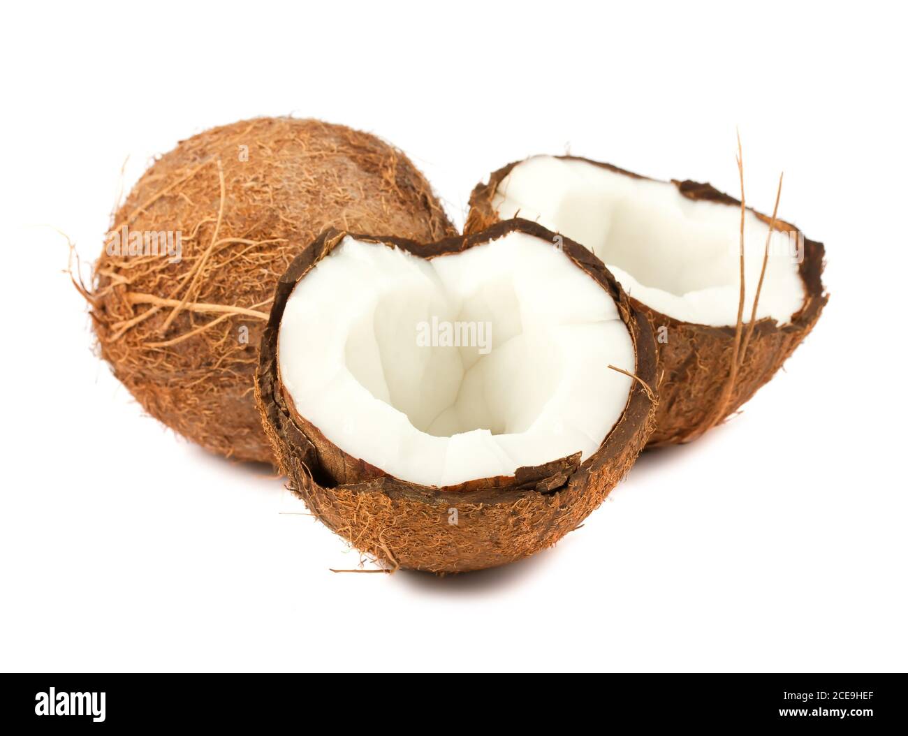 full and two halves of coconut Stock Photo - Alamy