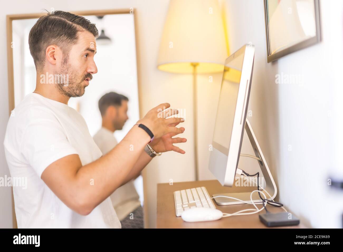 Caucasian male talking with body language while having a conference ...