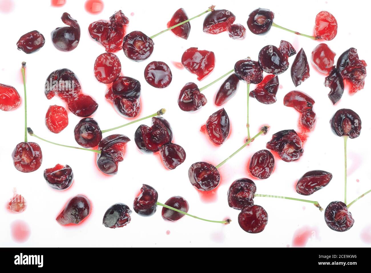 Crushed Cherry berries background Stock Photo - Alamy