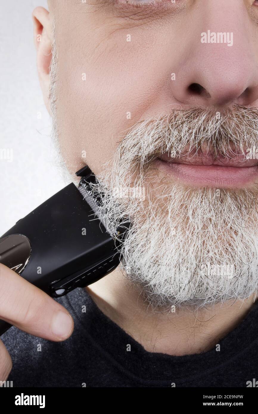 Man shaves his beard Stock Photo - Alamy Man shaves his beard Stock Photo - Alamy