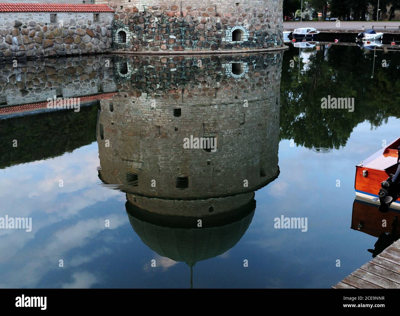 Corner Tower Mirroring In The Moat Of Vadstena Castle At Dusk On A ...