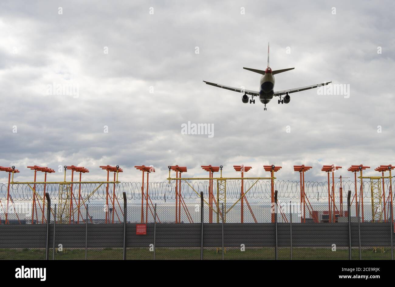 Overhead view of a plane landing at an Airport on a cloudy day Stock ...