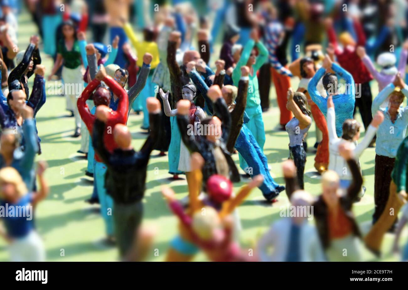 Miniature people dancing at a festival Stock Photo - Alamy