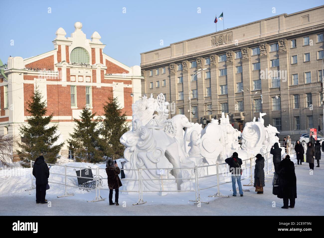 People admire the exhibition of ice and snow sculptures at the regional ...