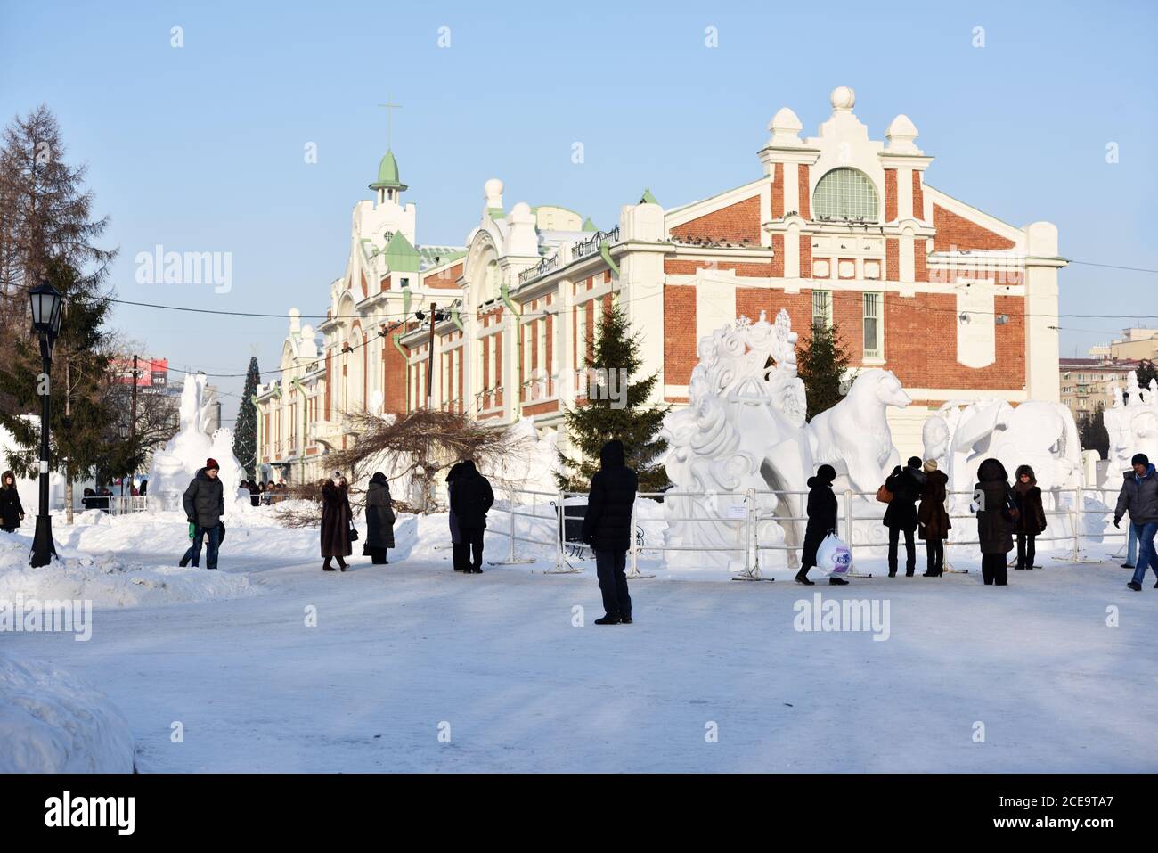 People admire the exhibition of ice and snow sculptures at the ...