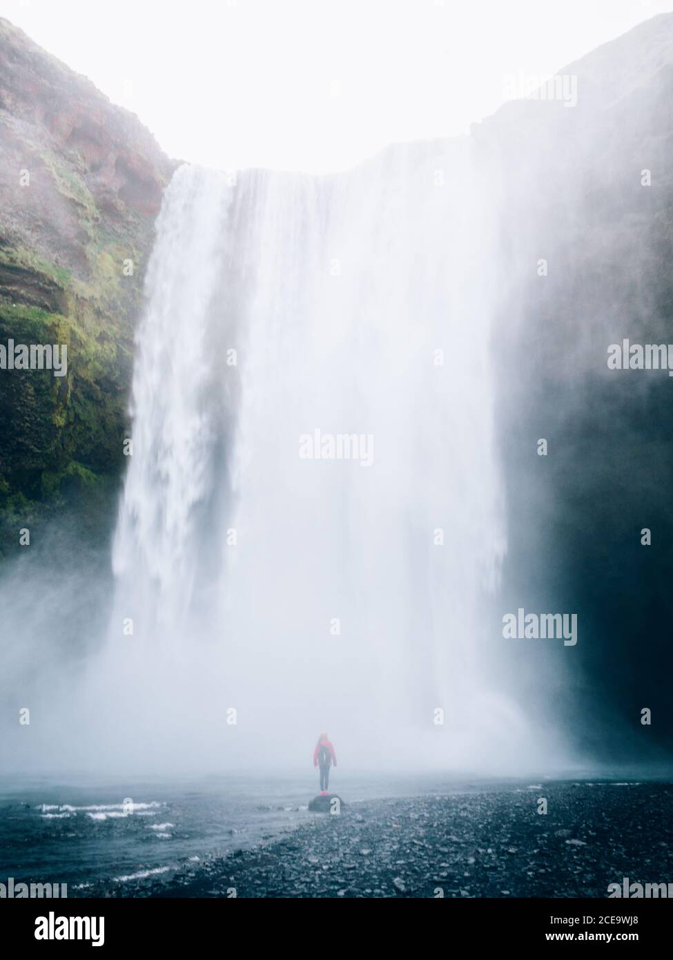 Person standing waterfall hi-res stock photography and images - Alamy