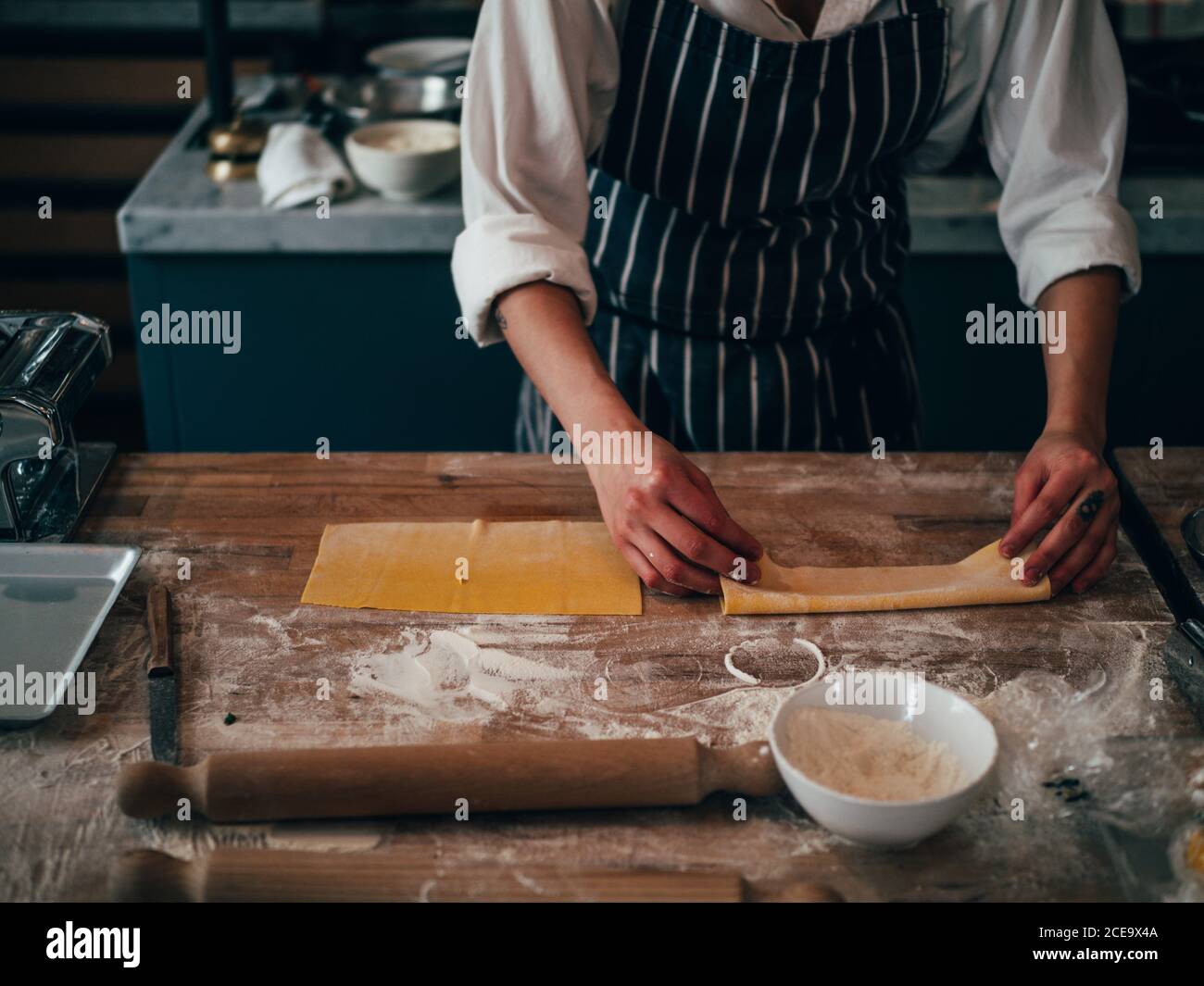 Crop cook making pasta Stock Photo - Alamy