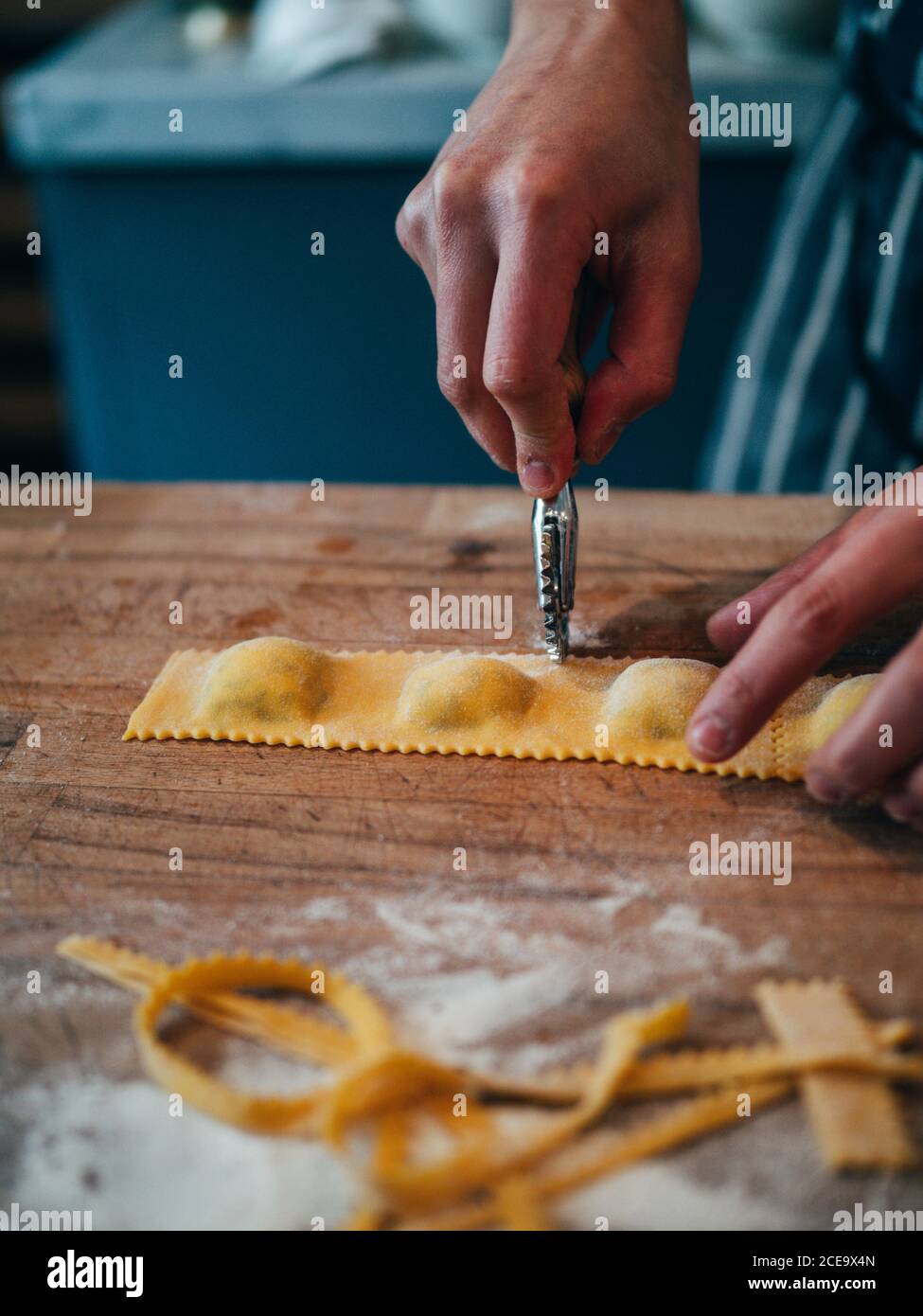 Crop person cutting ravioli Stock Photo - Alamy