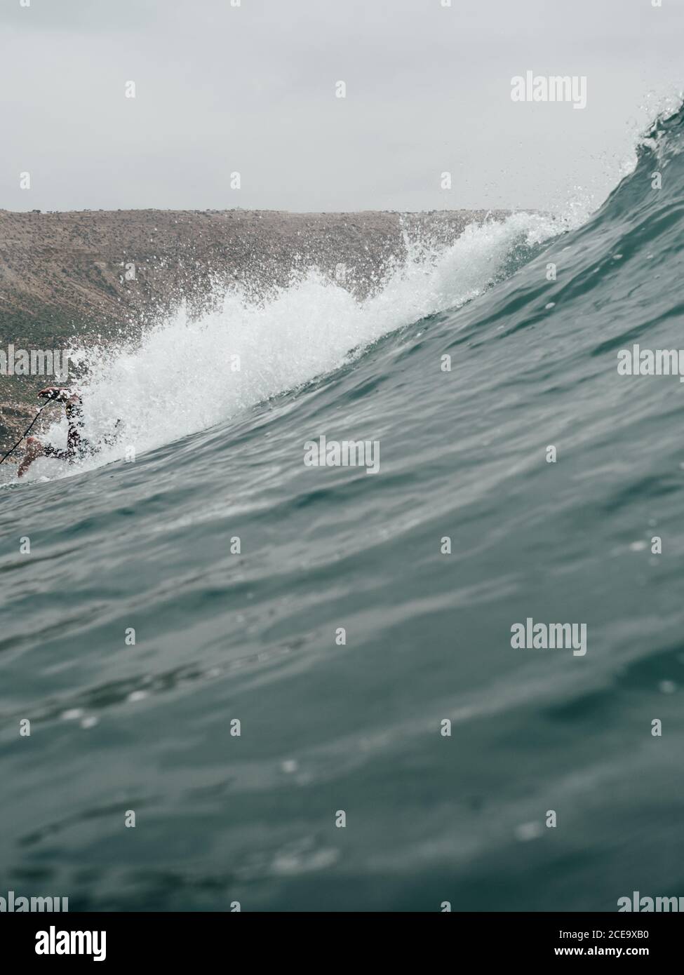 Surfer falling to wave Stock Photo - Alamy