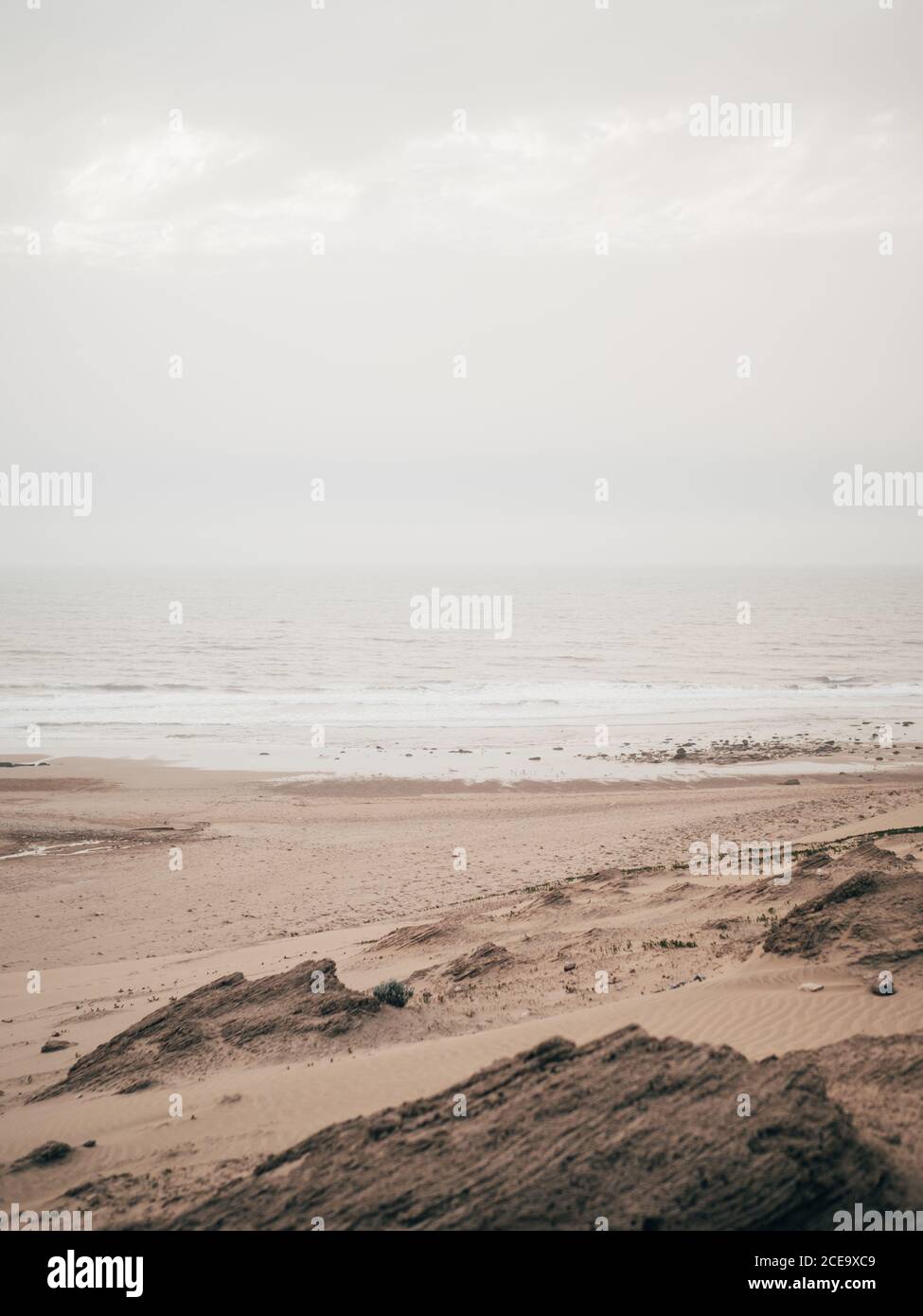 Calm ocean in cloudy day Stock Photo - Alamy