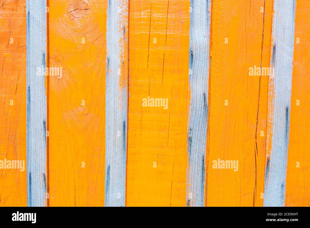 The fence in bright orange paint Stock Photo - Alamy