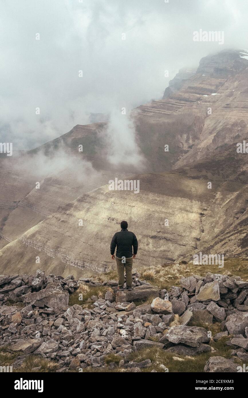 Back view male standing castro valnera mountain between mist burgos hi ...