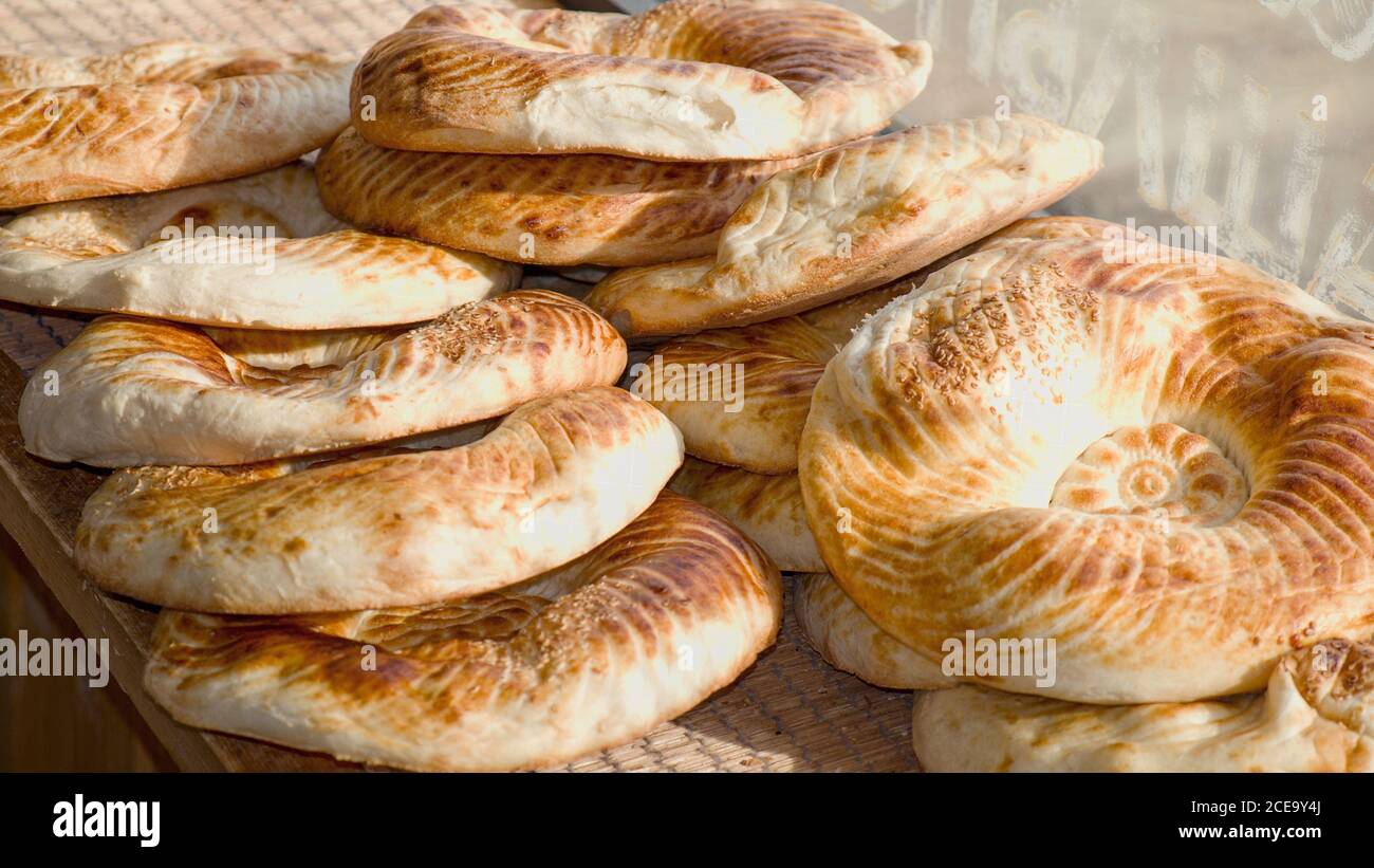 Typical traditional flatbread with crunchy crust with sesam just baked ...