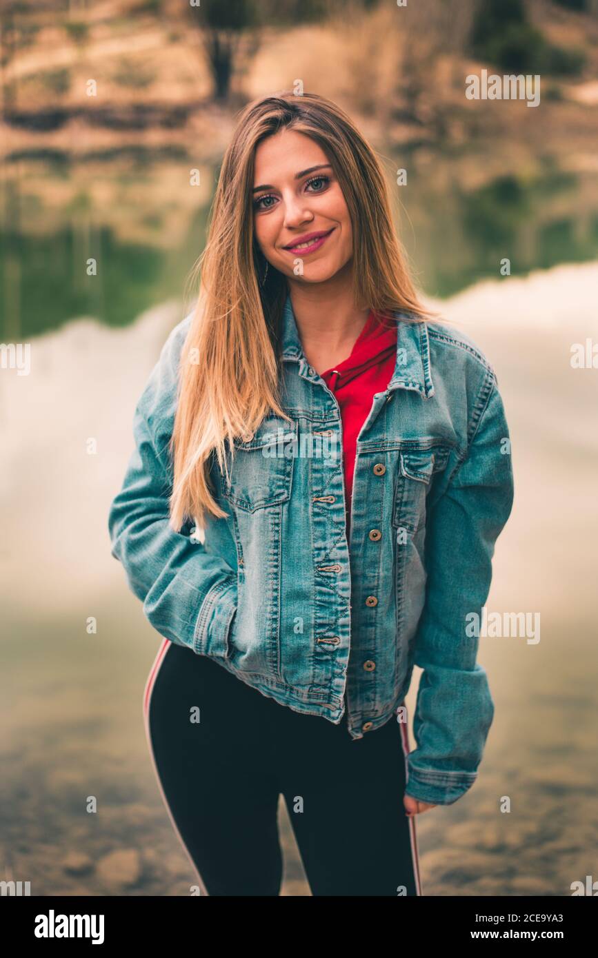Woman standing in nature hi-res stock photography and images - Alamy