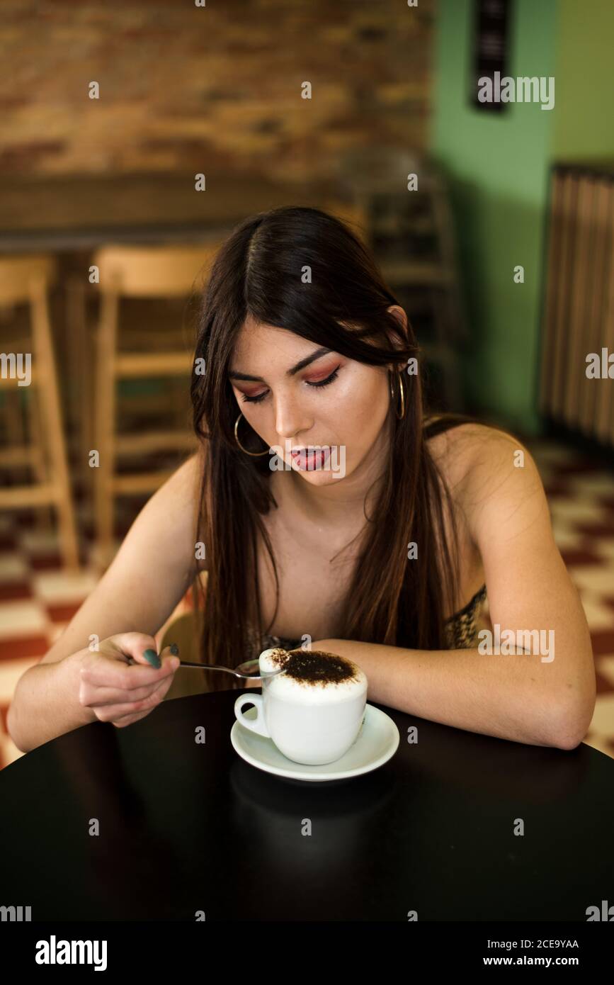 Beautiful lady sitting in cafe with coffee Stock Photo - Alamy