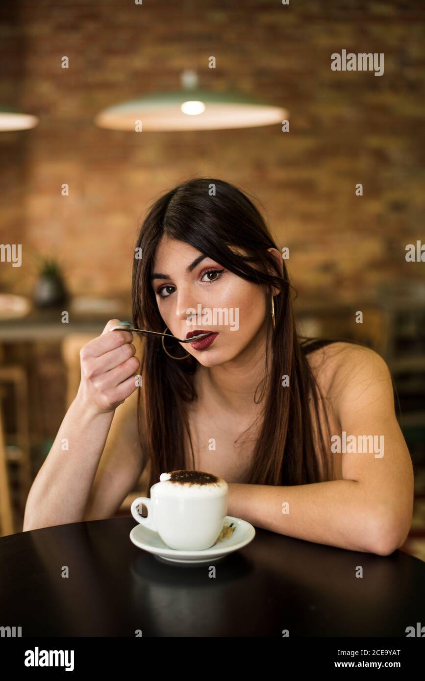 Beautiful lady sitting in cafe with coffee Stock Photo - Alamy