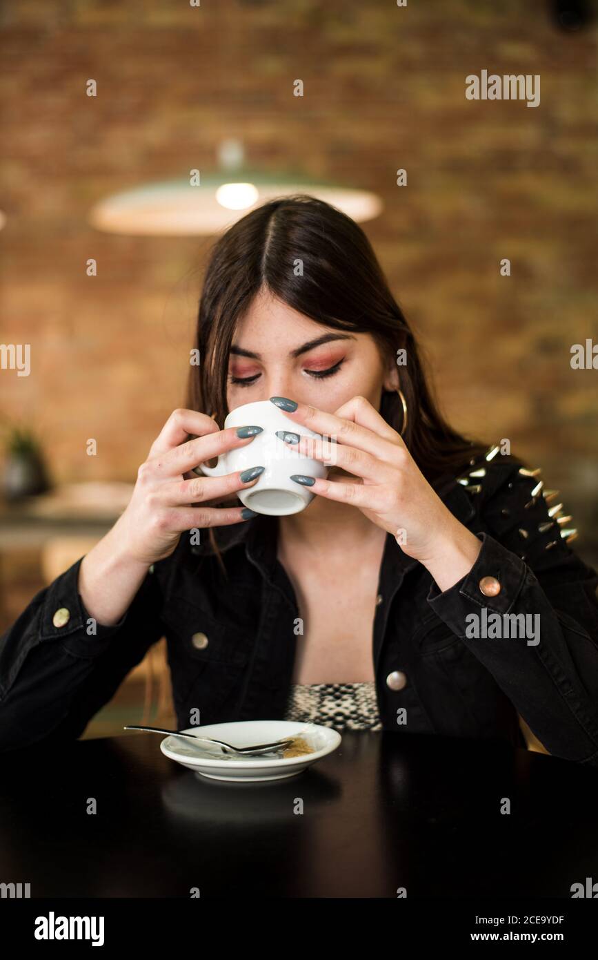 Beautiful lady sitting in cafe with coffee Stock Photo - Alamy
