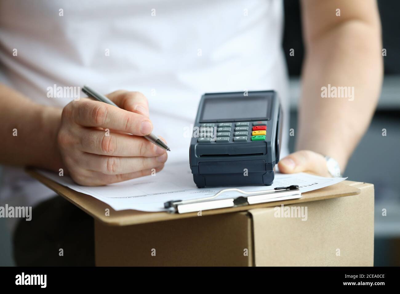 Male hand sign order receipt close up and pay by terminal Stock Photo ...
