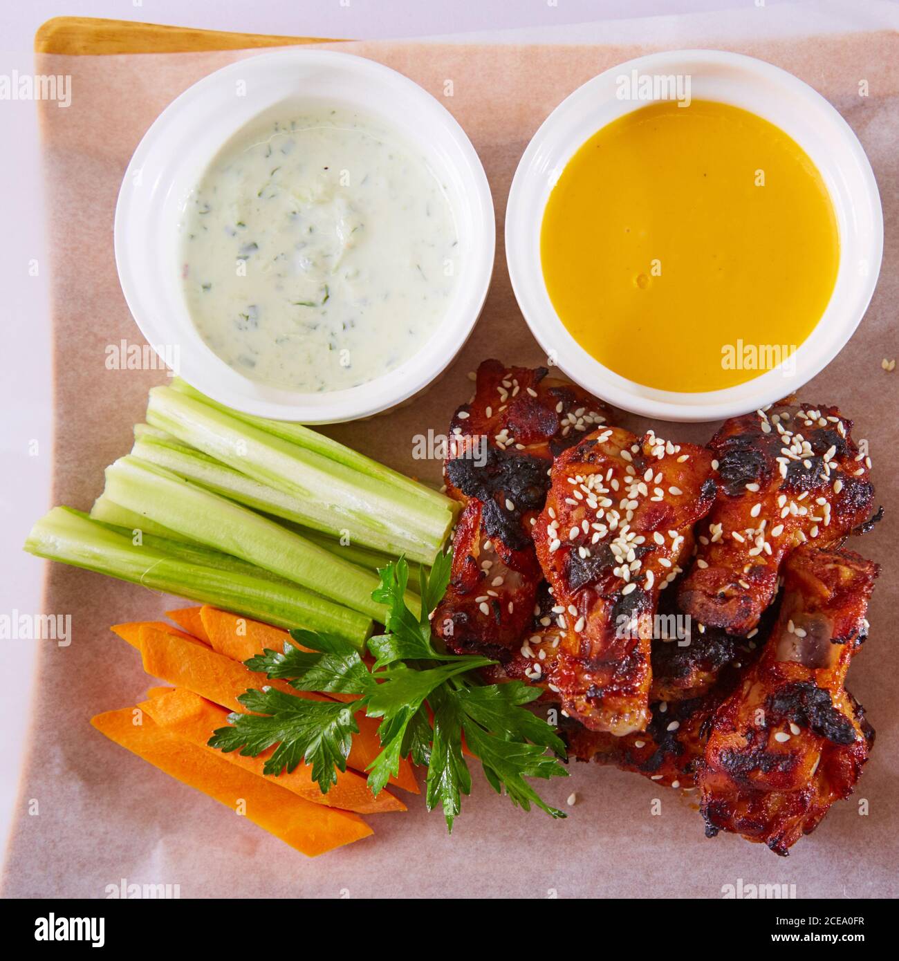 boneless buffalo bbq chicken wngs with ranch sauce Stock Photo - Alamy
