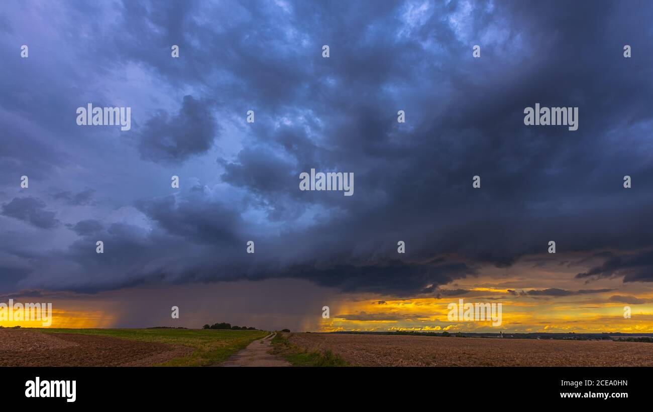 Supercell storm clouds with wall cloud and intense rain Stock Photo - Alamy