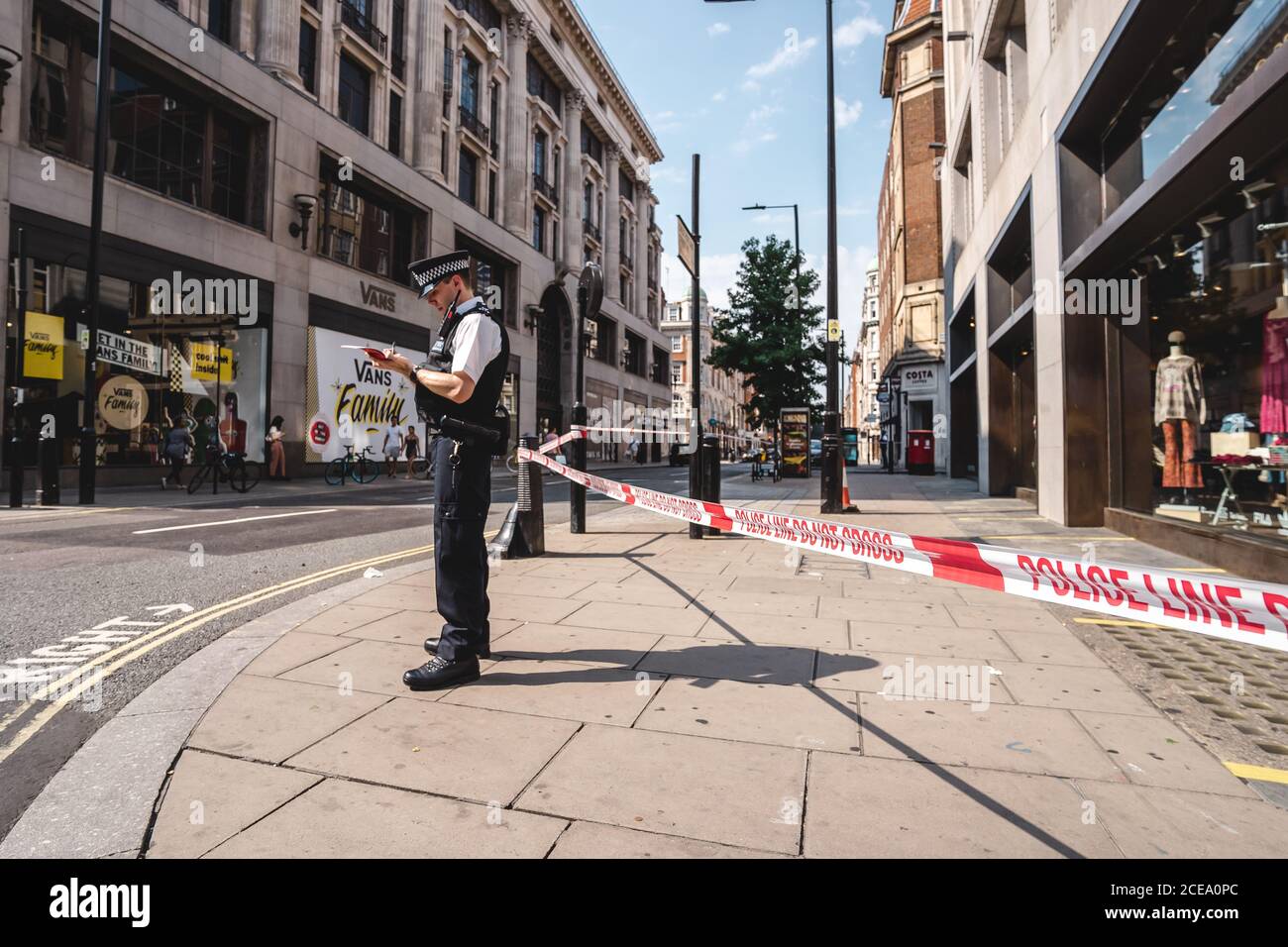 London / UK - 08/09/2020: Police officers securing the perimeter after ...