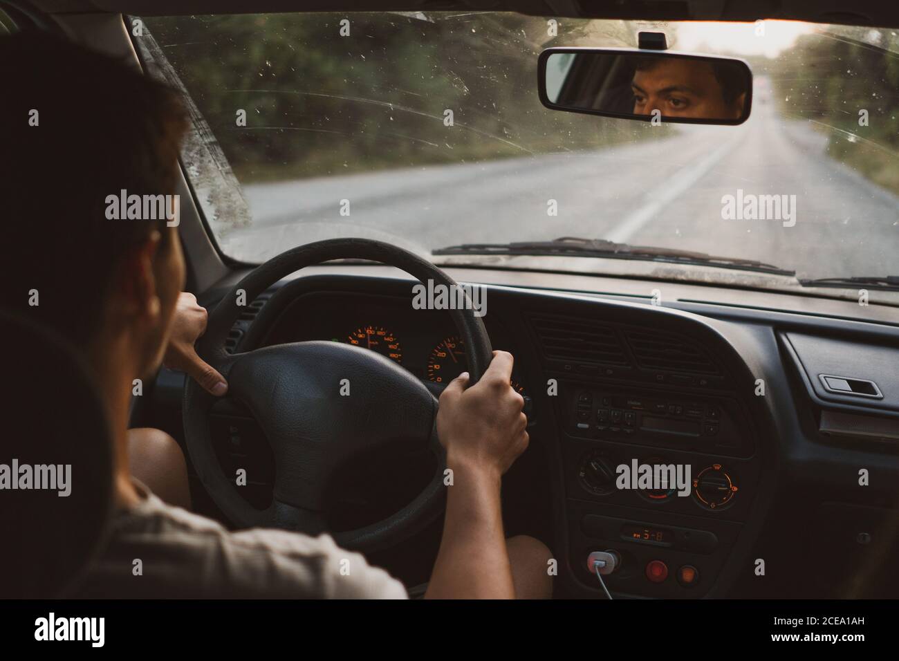 anonymous guy driving modern vehicle along asphalt road in amazing ...