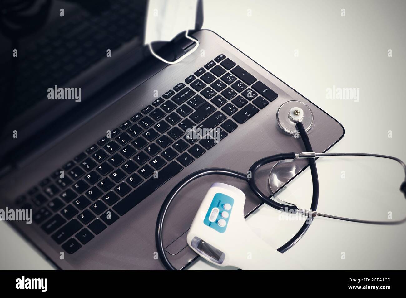 Stethoscope on laptop keyboard. Health care or IT security concept ...
