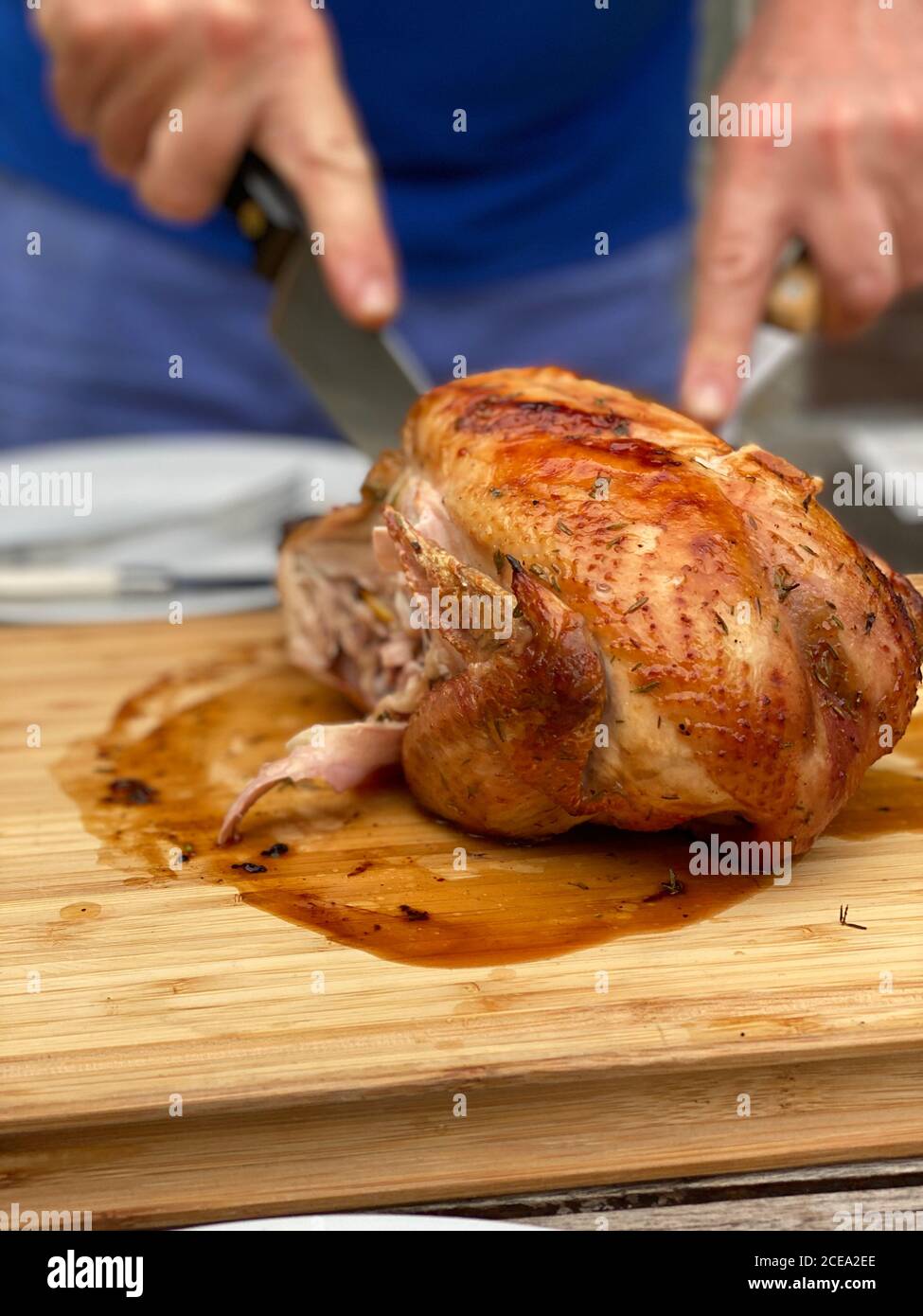 Man cooking roast chicken hi-res stock photography and images - Alamy