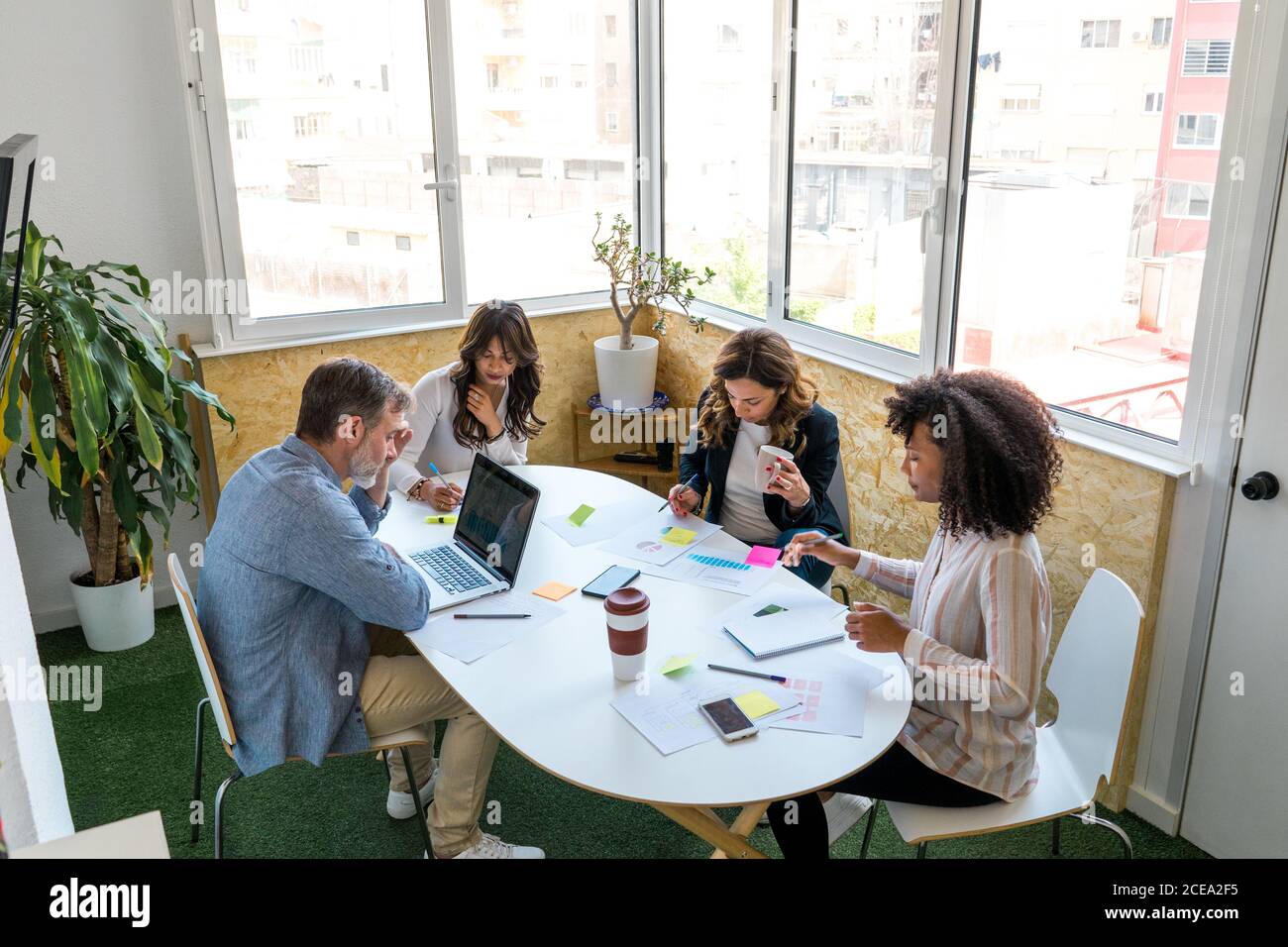 Colleagues communicating during work Stock Photo - Alamy