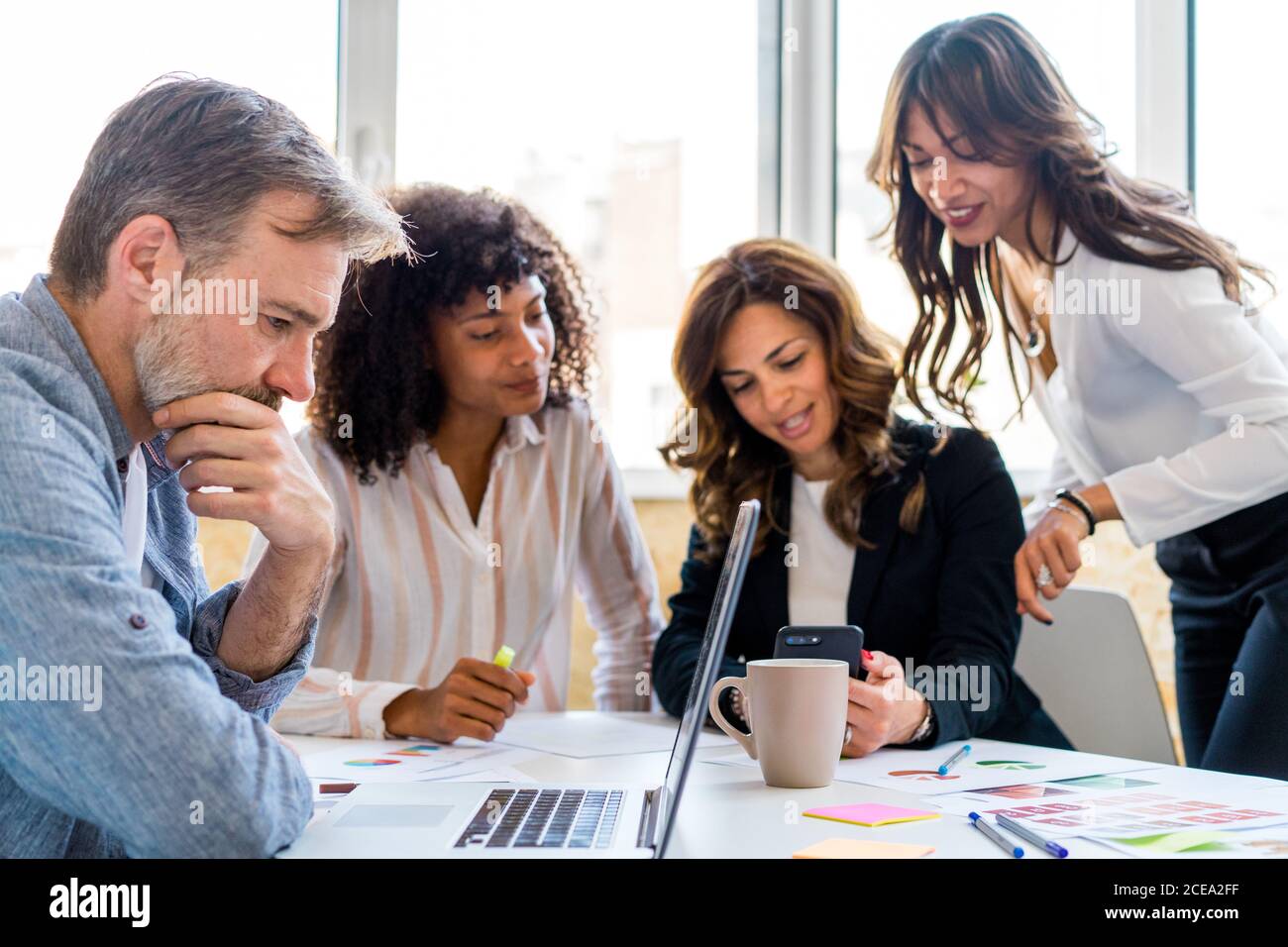 Analyzing colleagues work hi-res stock photography and images - Alamy