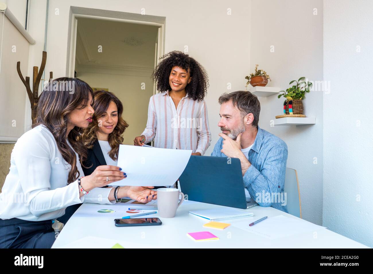 Analyzing colleagues work hi-res stock photography and images - Alamy