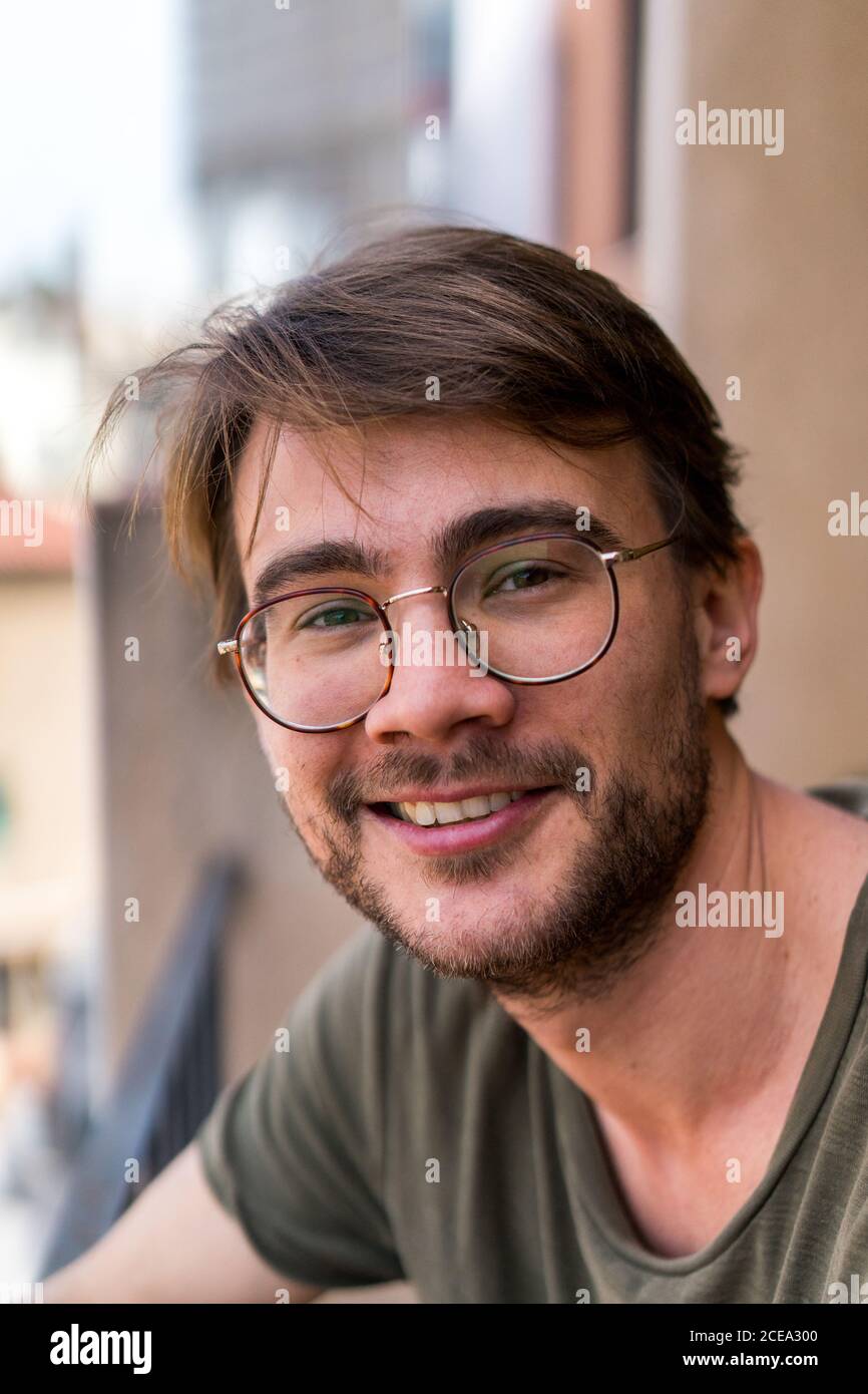 Attractive pleased man looking camera hi-res stock photography and ...
