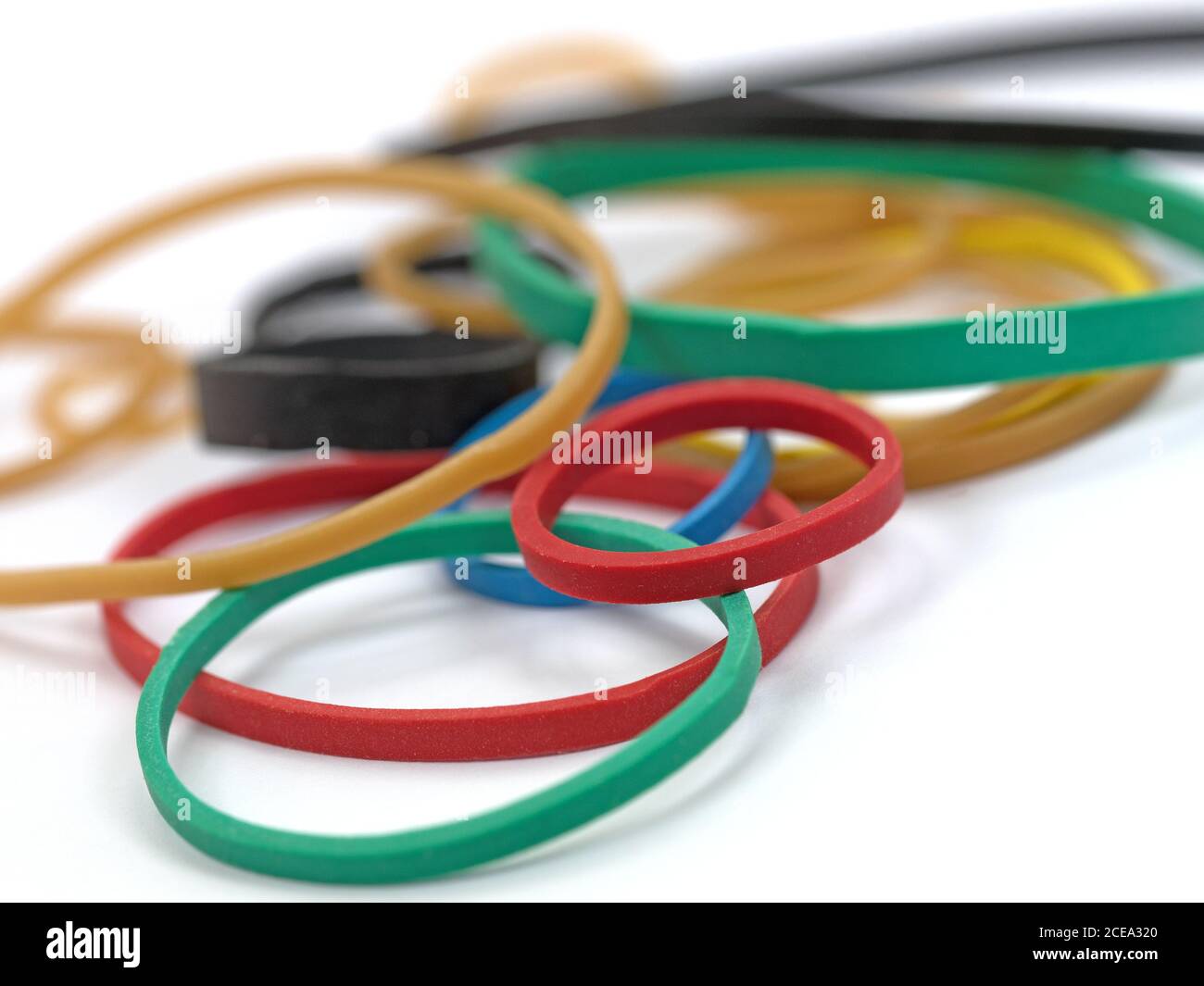 Colorful rubber rings against white background Stock Photo - Alamy
