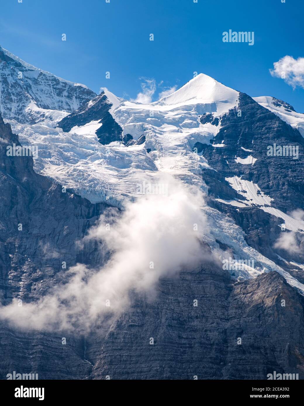 Nice view on the snow capped pyramid-shaped Silberhorn mountain, a ...