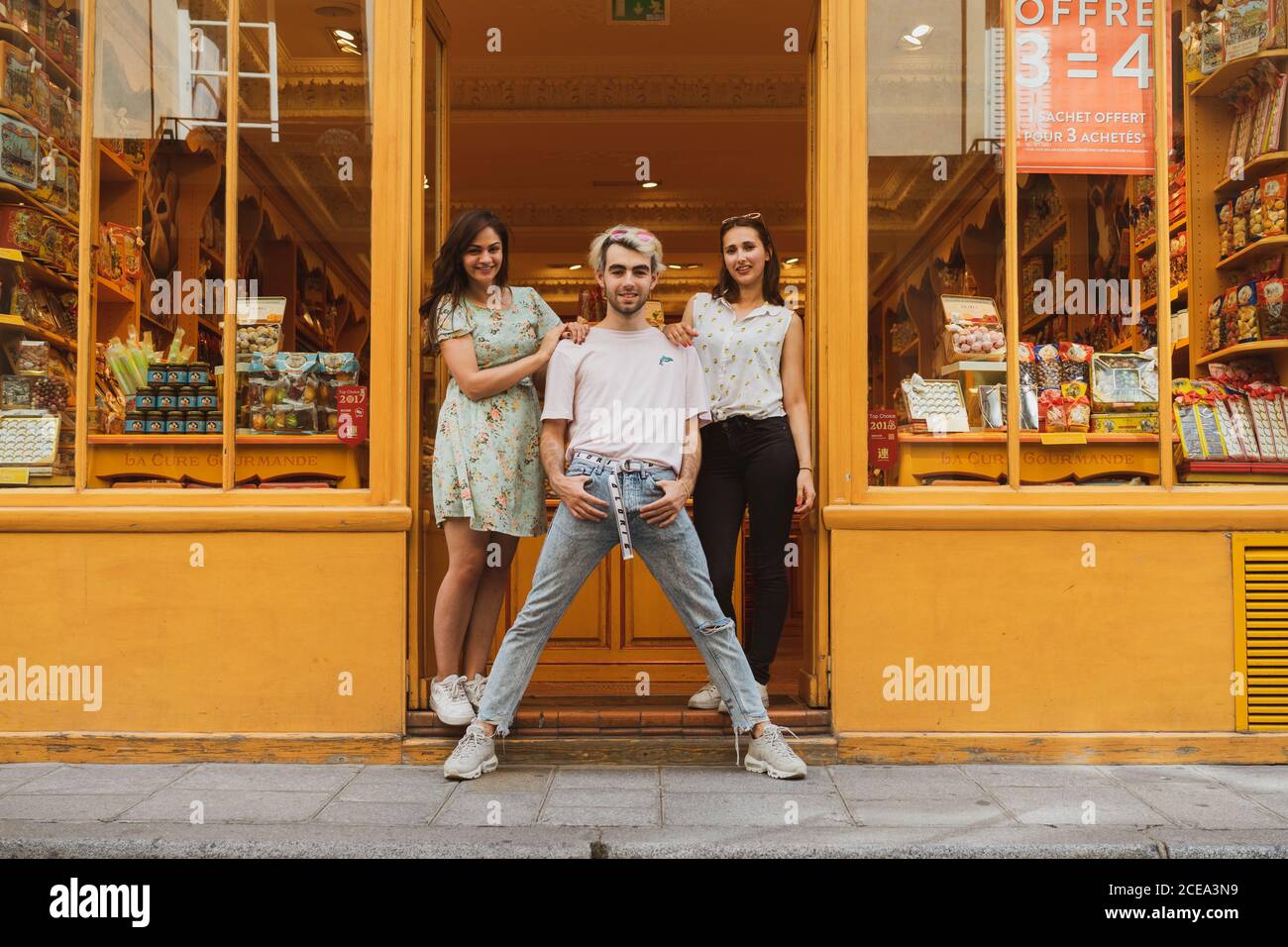 Friends standing with funny look Stock Photo - Alamy