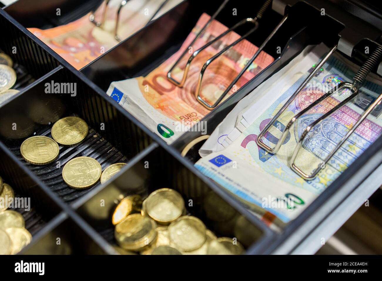 Cash and coins in till Stock Photo - Alamy
