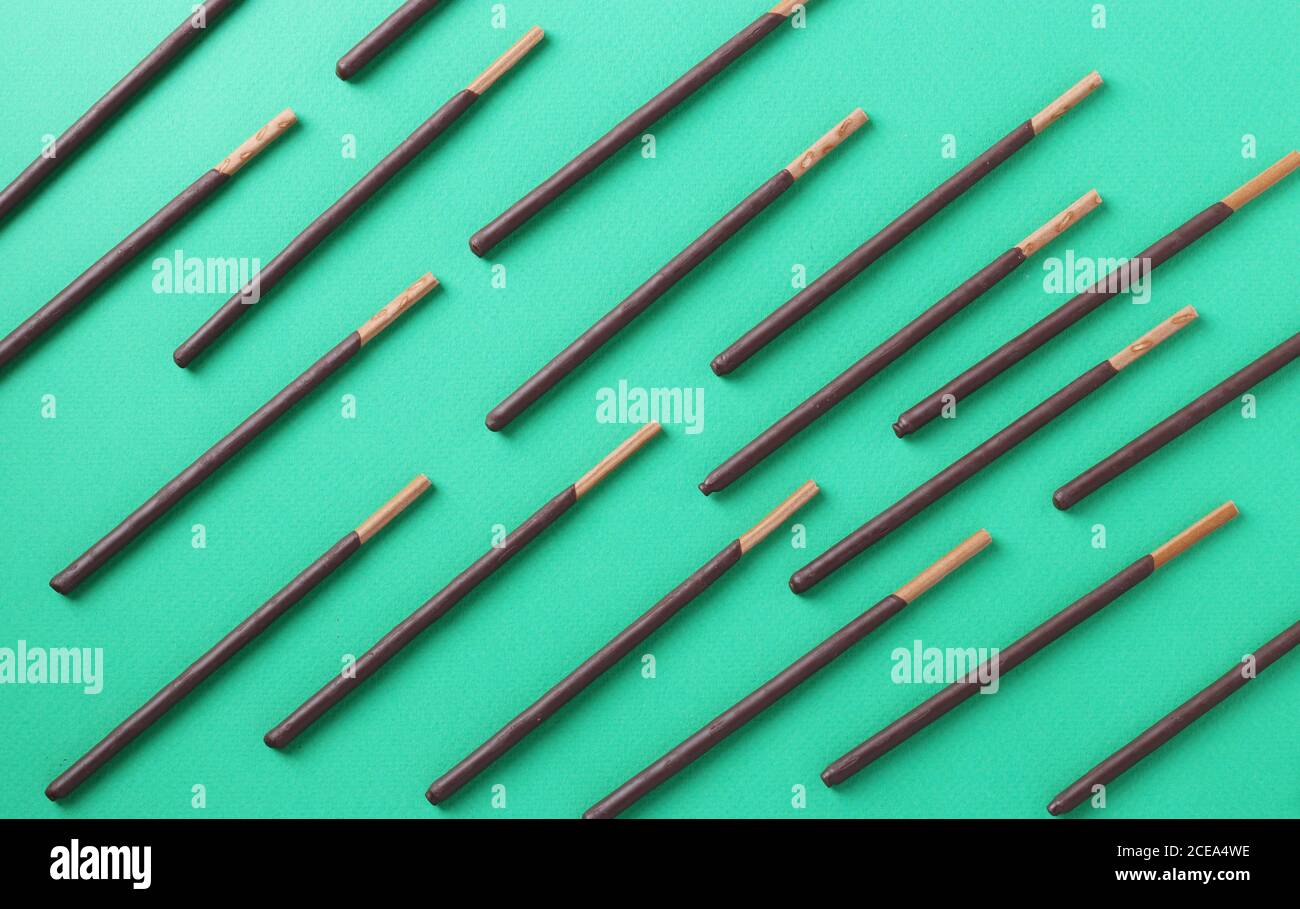 Pocky candy pattern on green background, design for text. Horizontal ...