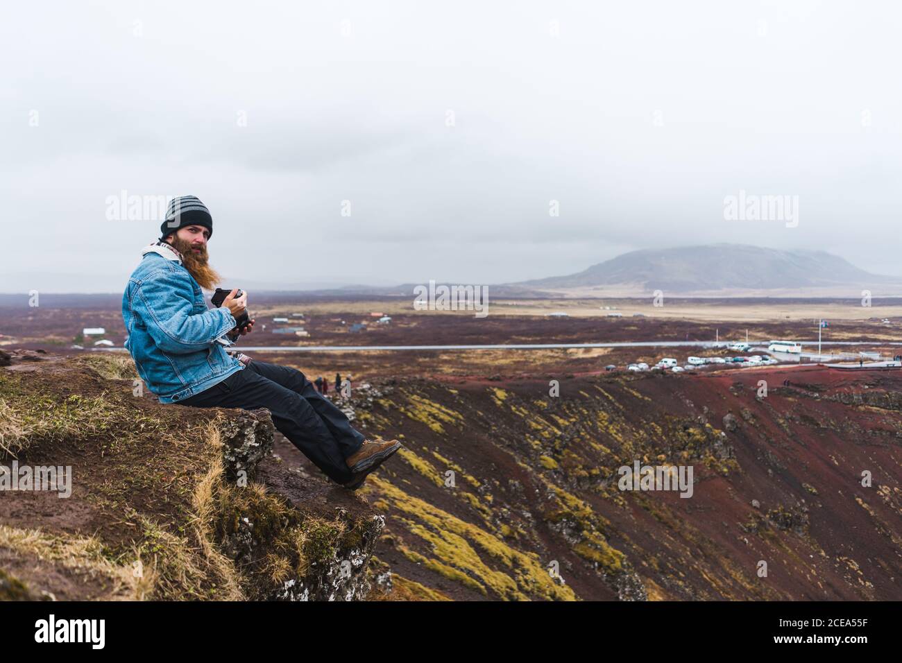 man looking at small lake Stock Photo - Alamy