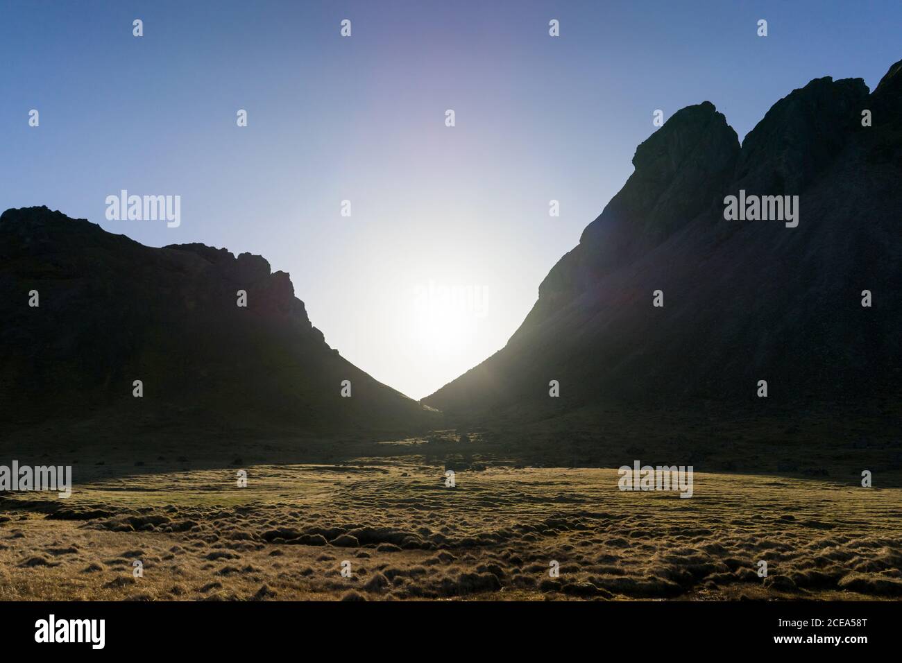 Landscape of sun between mountains Stock Photo - Alamy