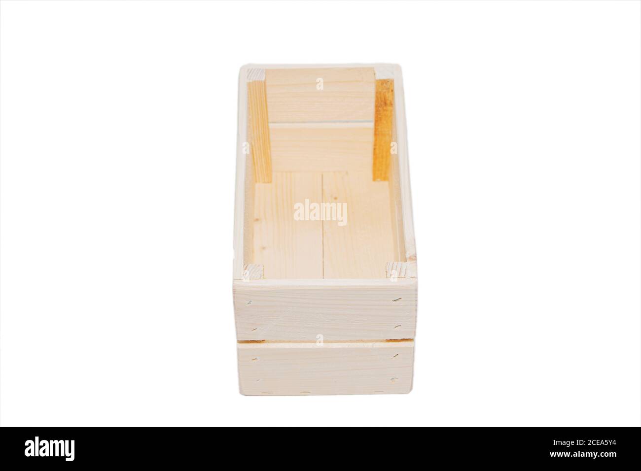 An empty wooden box. Made of pine and plywood, on a light white ...
