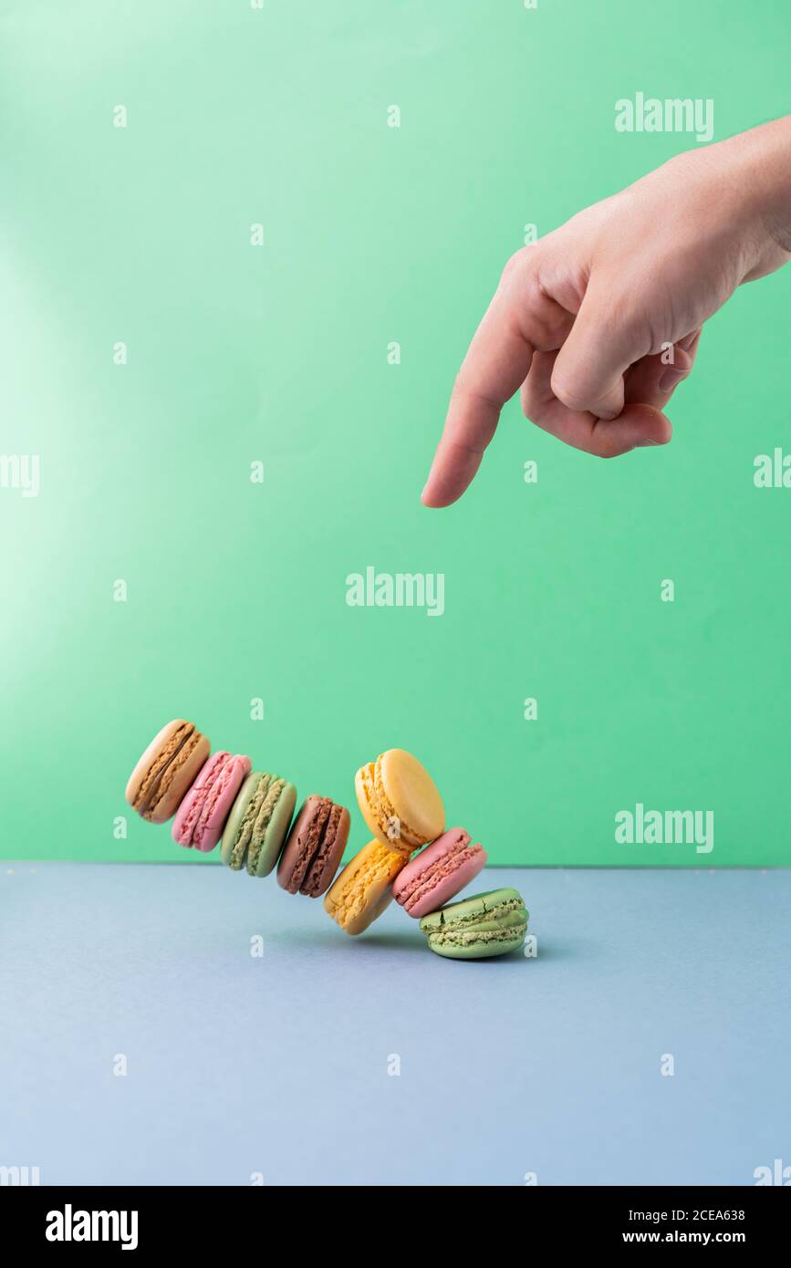 Male hand in silver bracelet with showing finger on falling pile of ...