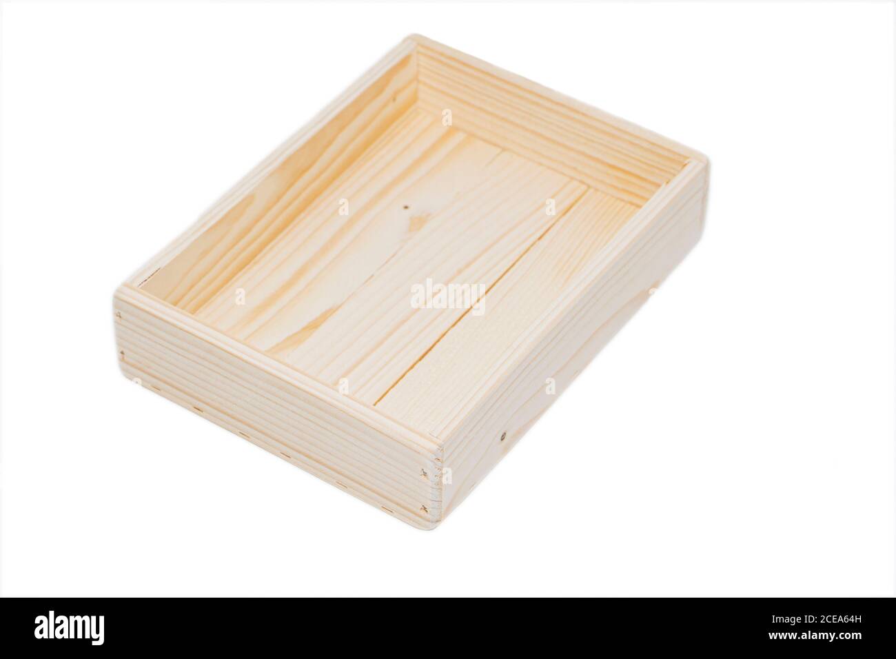An empty wooden box. Made of pine and plywood, on a light white ...