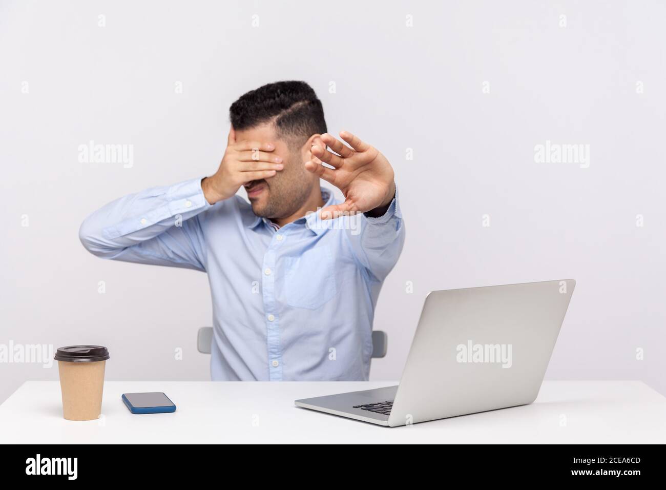 No, don't want to look! Businessman sitting office workplace with ...