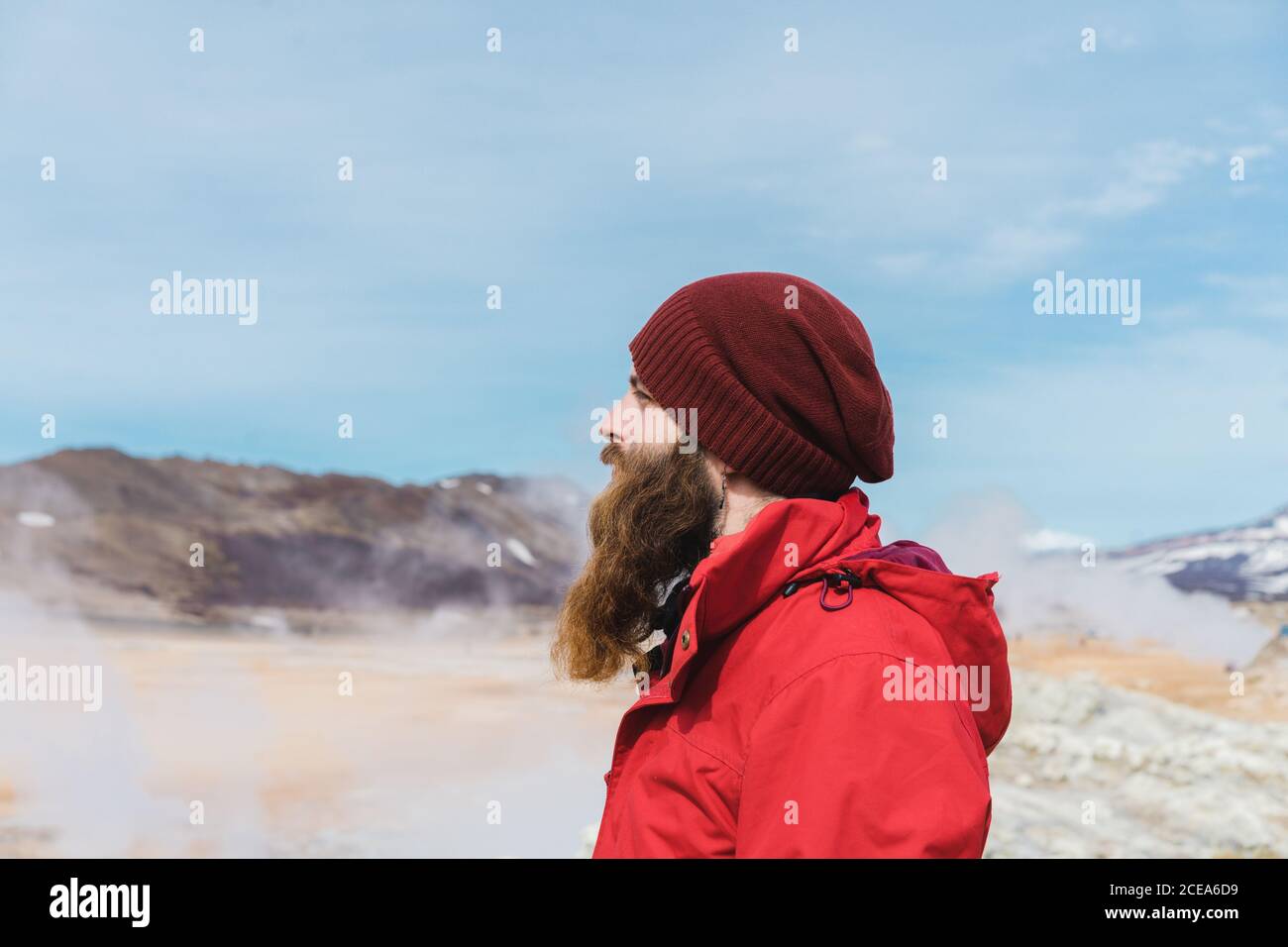 man standing at geyser Stock Photo - Alamy