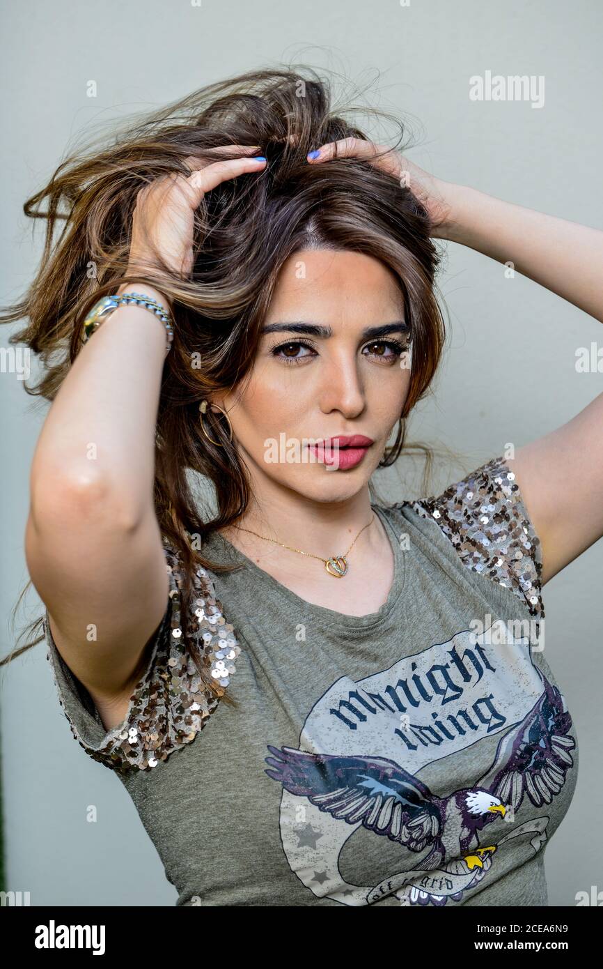 female Arab model after makeup and hair style on white background Stock ...