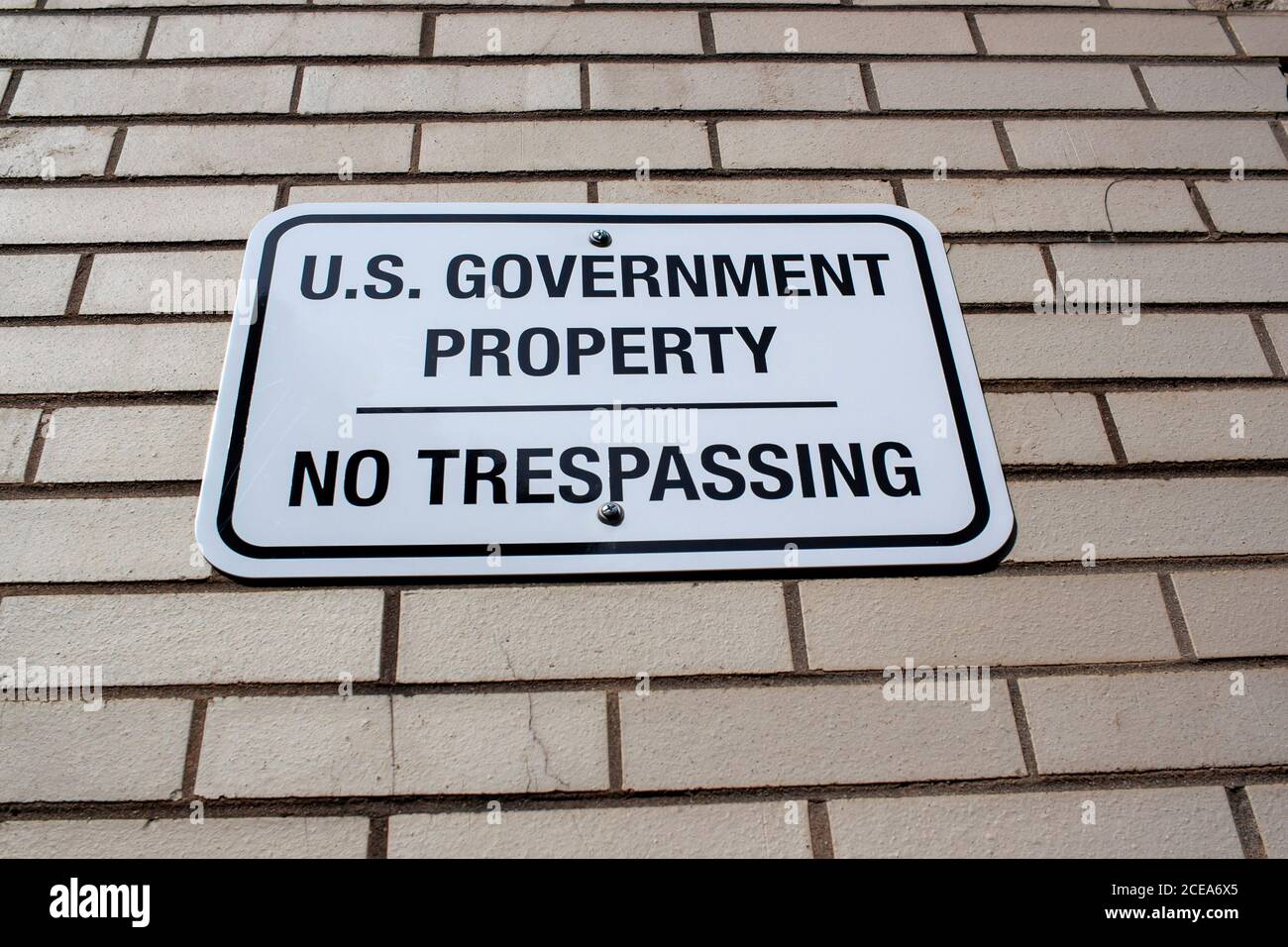 Metal sign attached to brick building hi-res stock photography and ...