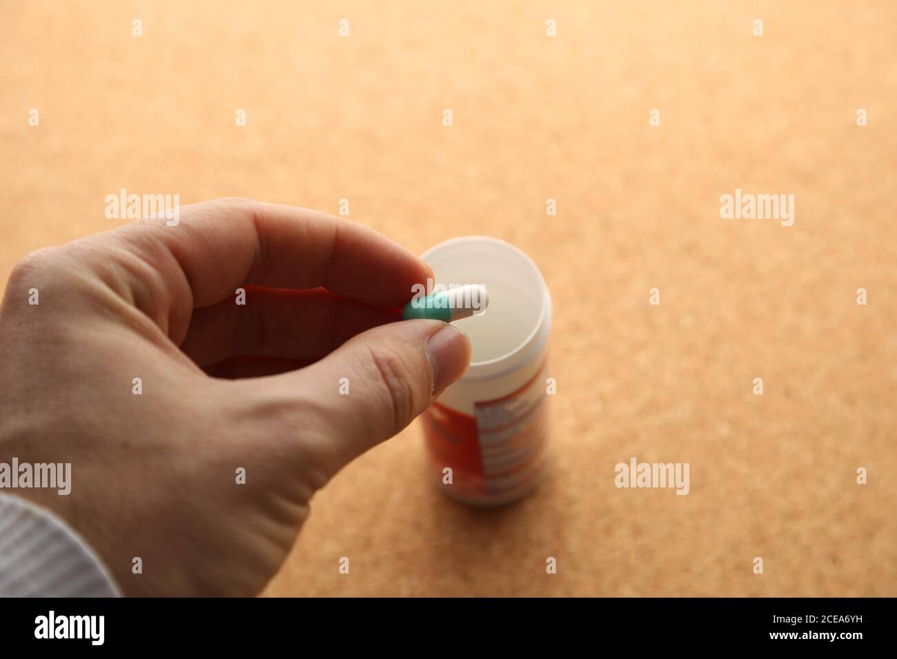 Person taking supplement bottle in hi-res stock photography and images ...