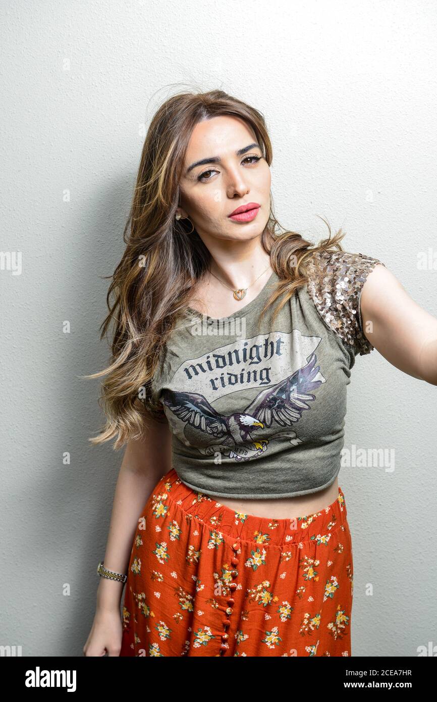 female Arab model after makeup and hair style on white background Stock ...