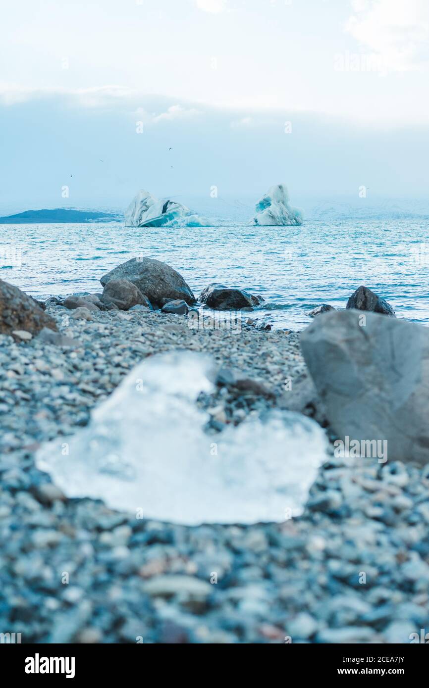 Ice lumps in water Stock Photo - Alamy