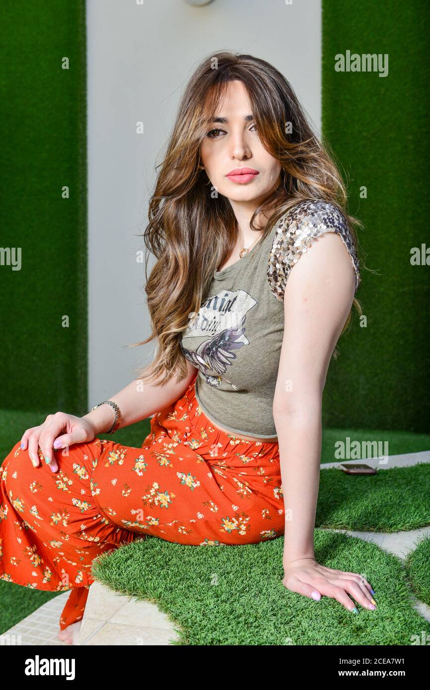 female Arab model after makeup and hair style on white background Stock ...